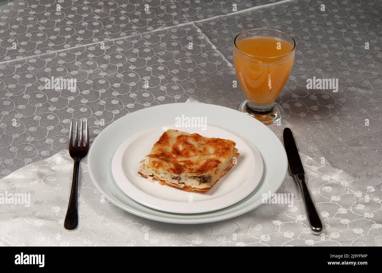 A water pastry in a white ceramic plate. Water pastry, which is a tray ...