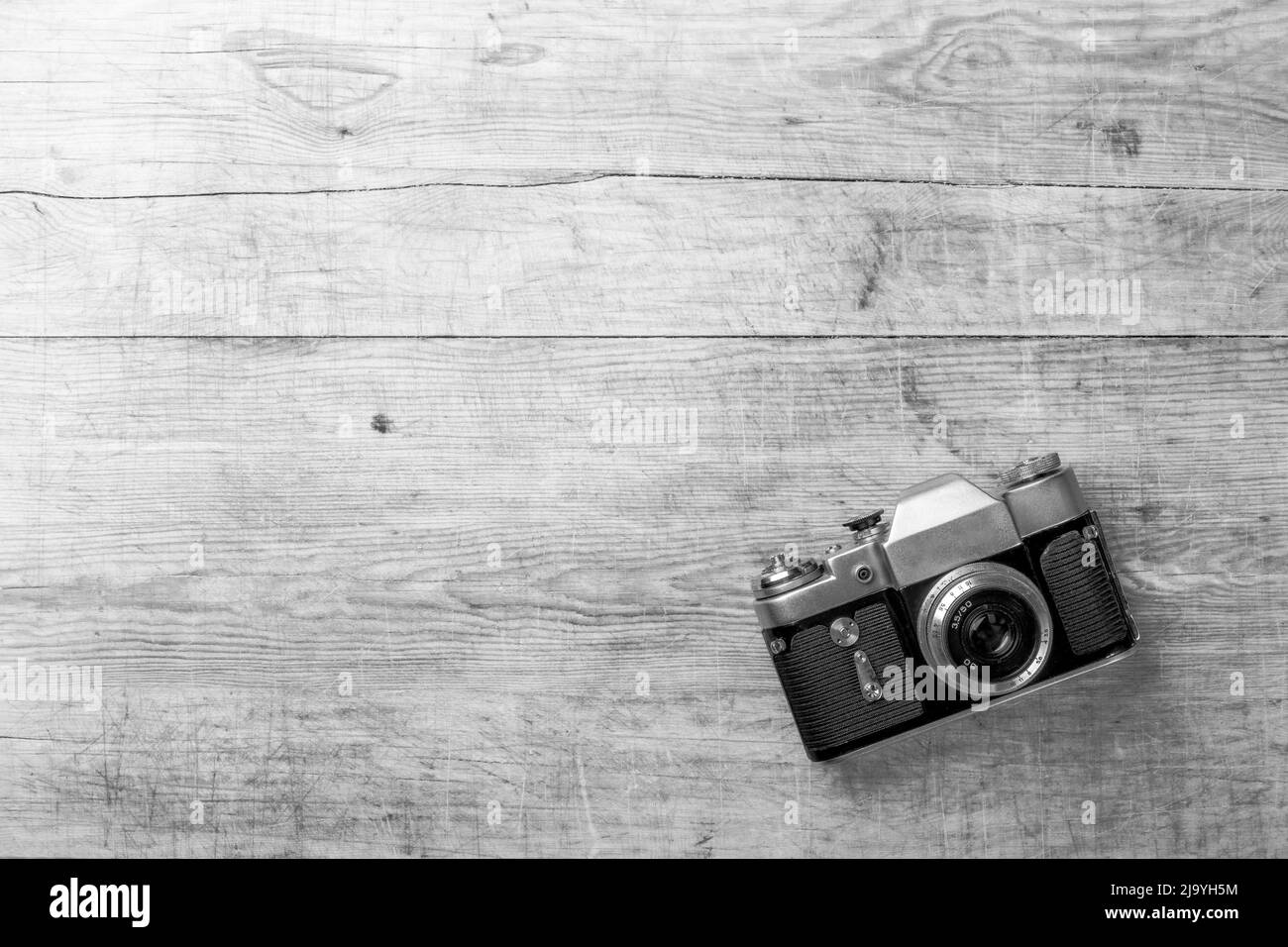 top view of retro camera on wooden table Stock Photo - Alamy