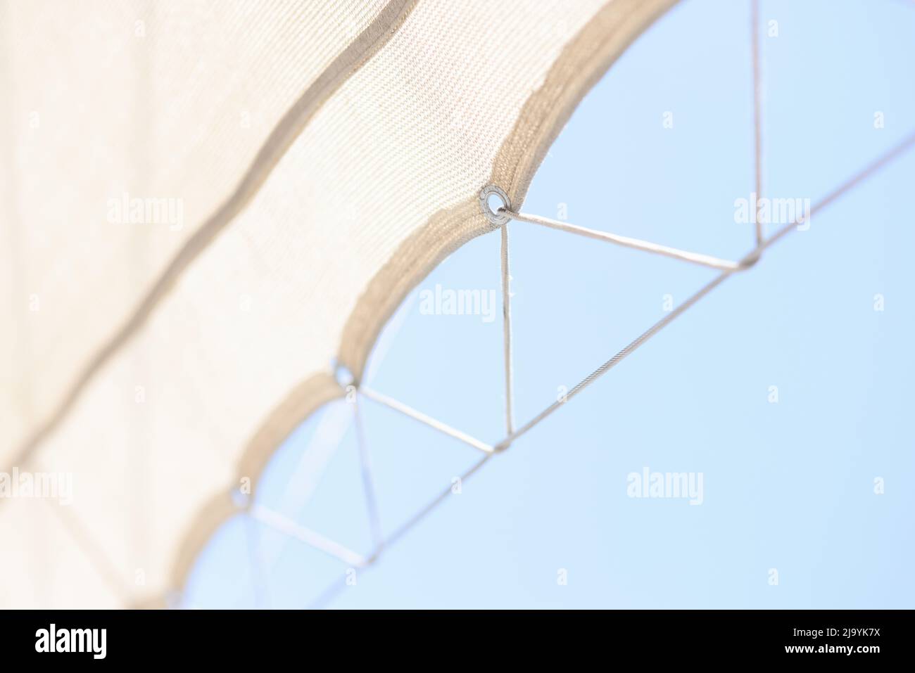 Beach umbrella on stretched rope closeup. Quality parasol Stock Photo ...