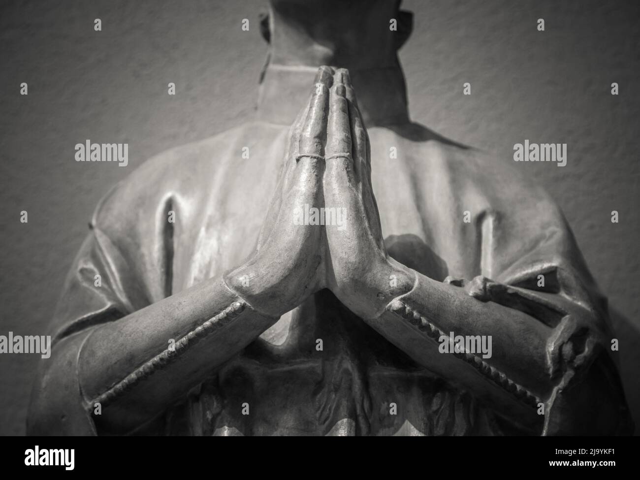 Man hands praying ancient sculpture Stock Photo - Alamy