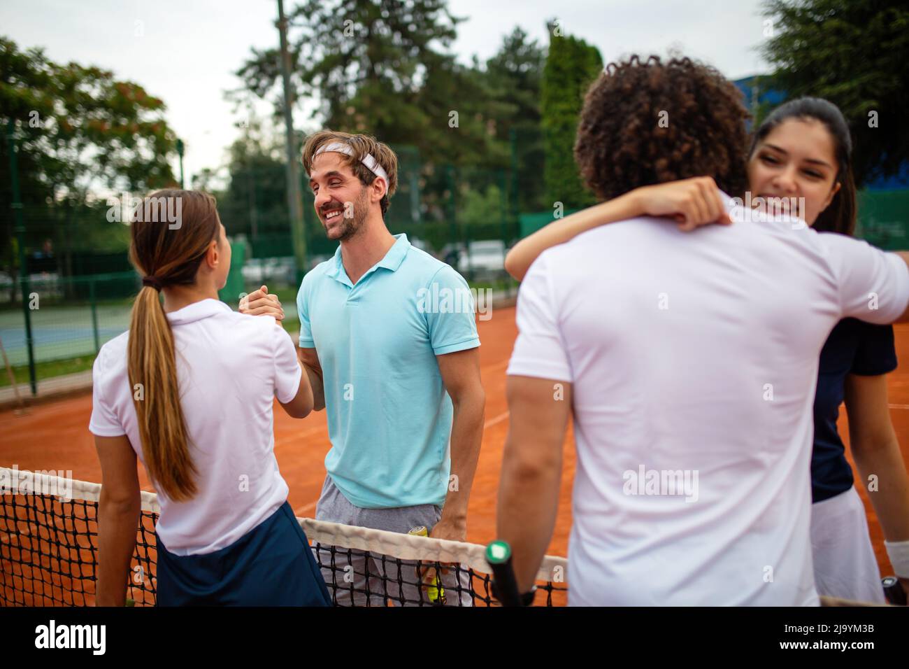 Group of tennis people players giving a handshake after a match Stock ...