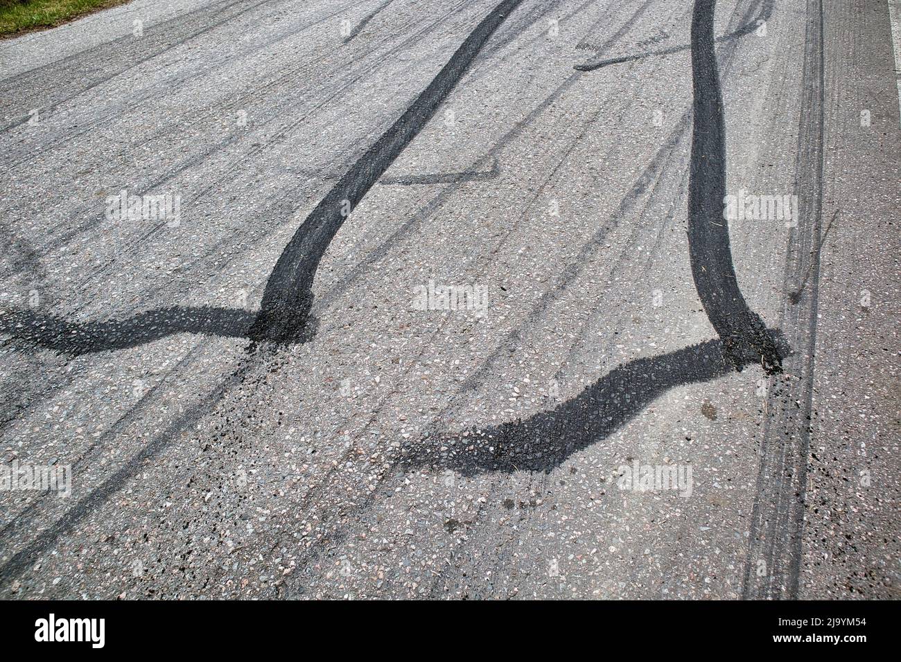 Black tire marks on the road Stock Photo - Alamy