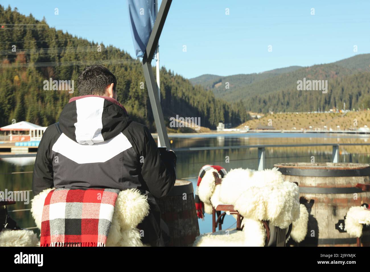 Man sitting and relaxing outdoor in resort Stock Photo - Alamy