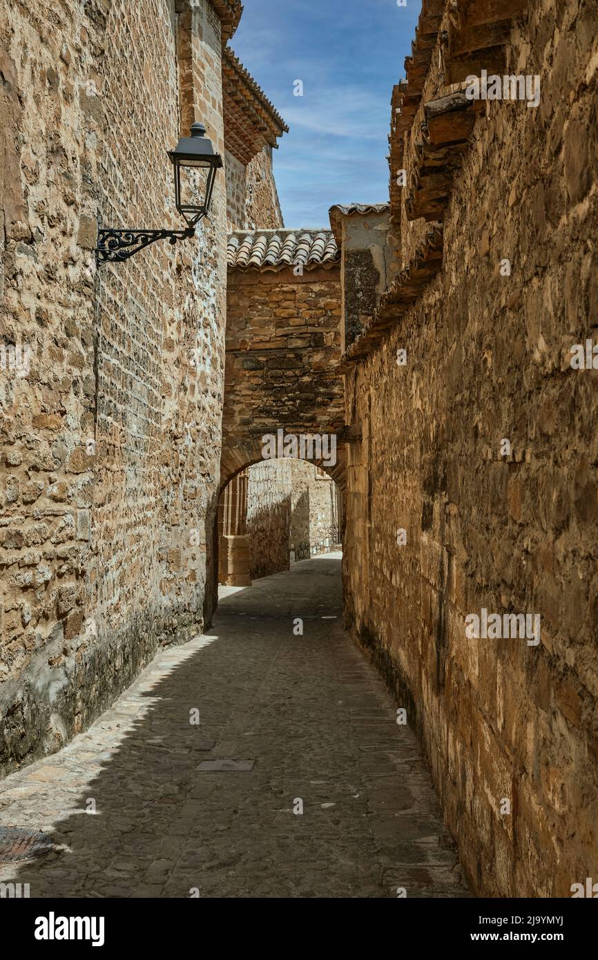medieval stone walkway with wall and archway Stock Photo - Alamy