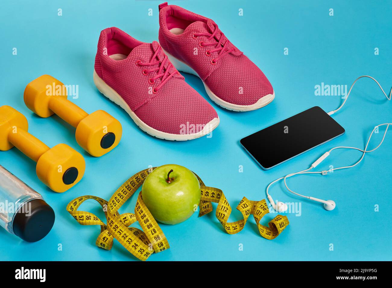 Healthy concept, diet plan with sport shoes and bottle of water and ...