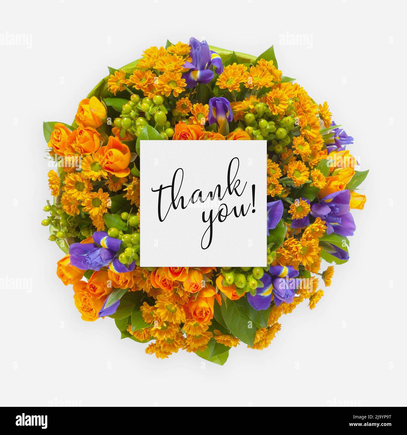 Fresh flowers bunch and card with words thank you written on it Stock ...