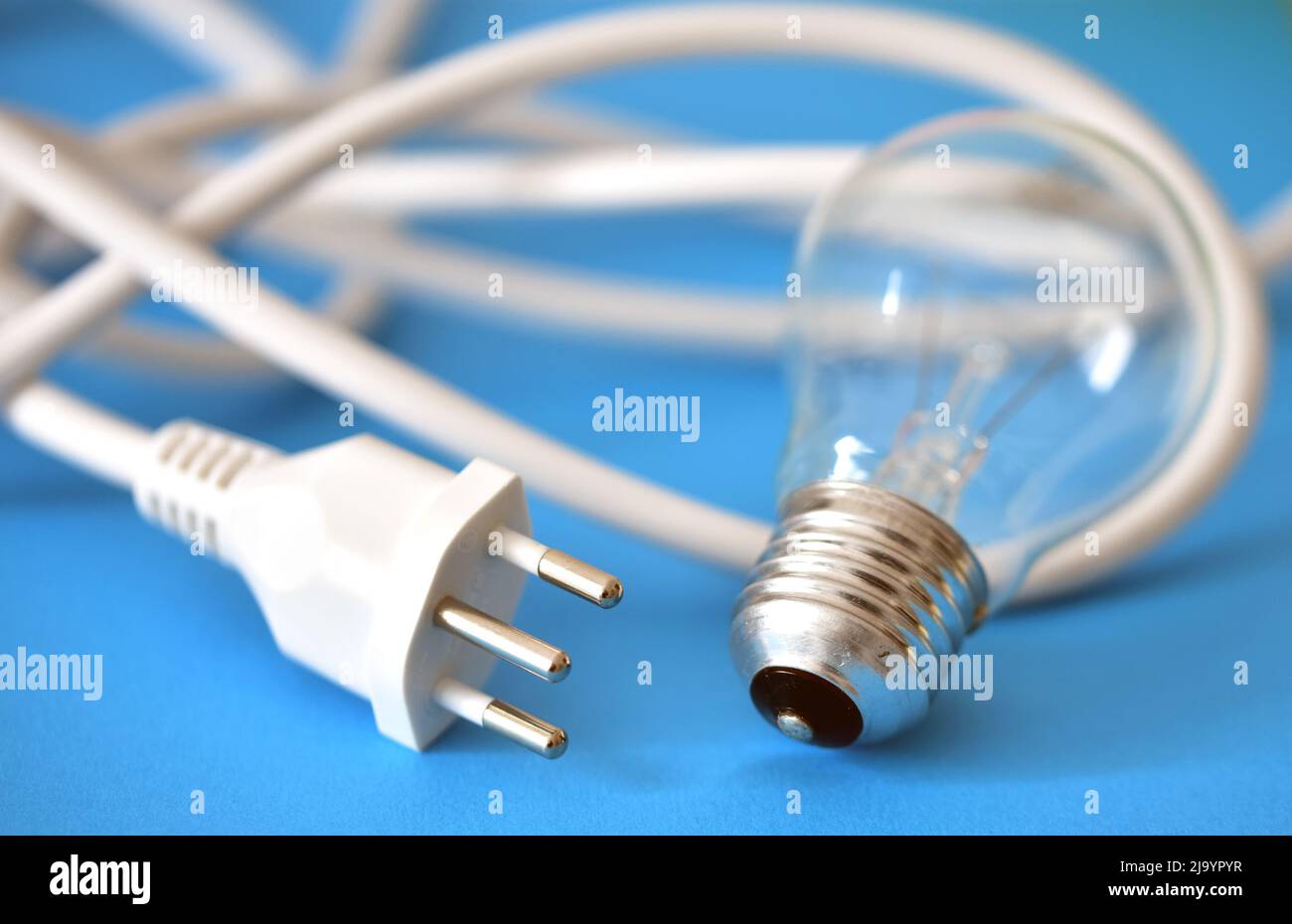 power plug with light buld Stock Photo - Alamy