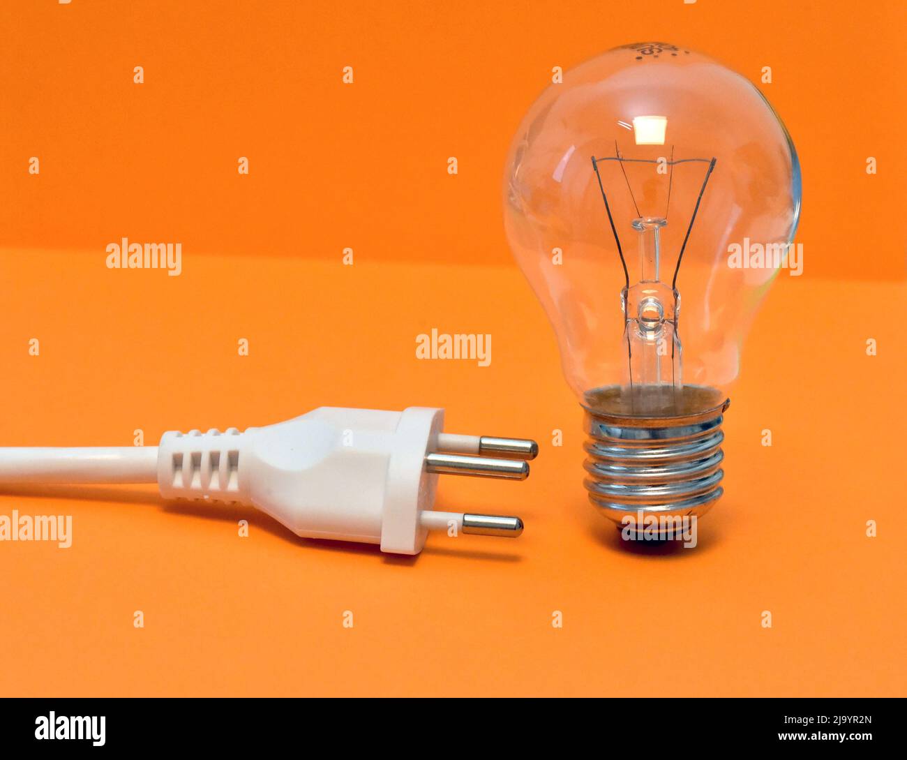 outlet plug with light buld Stock Photo - Alamy