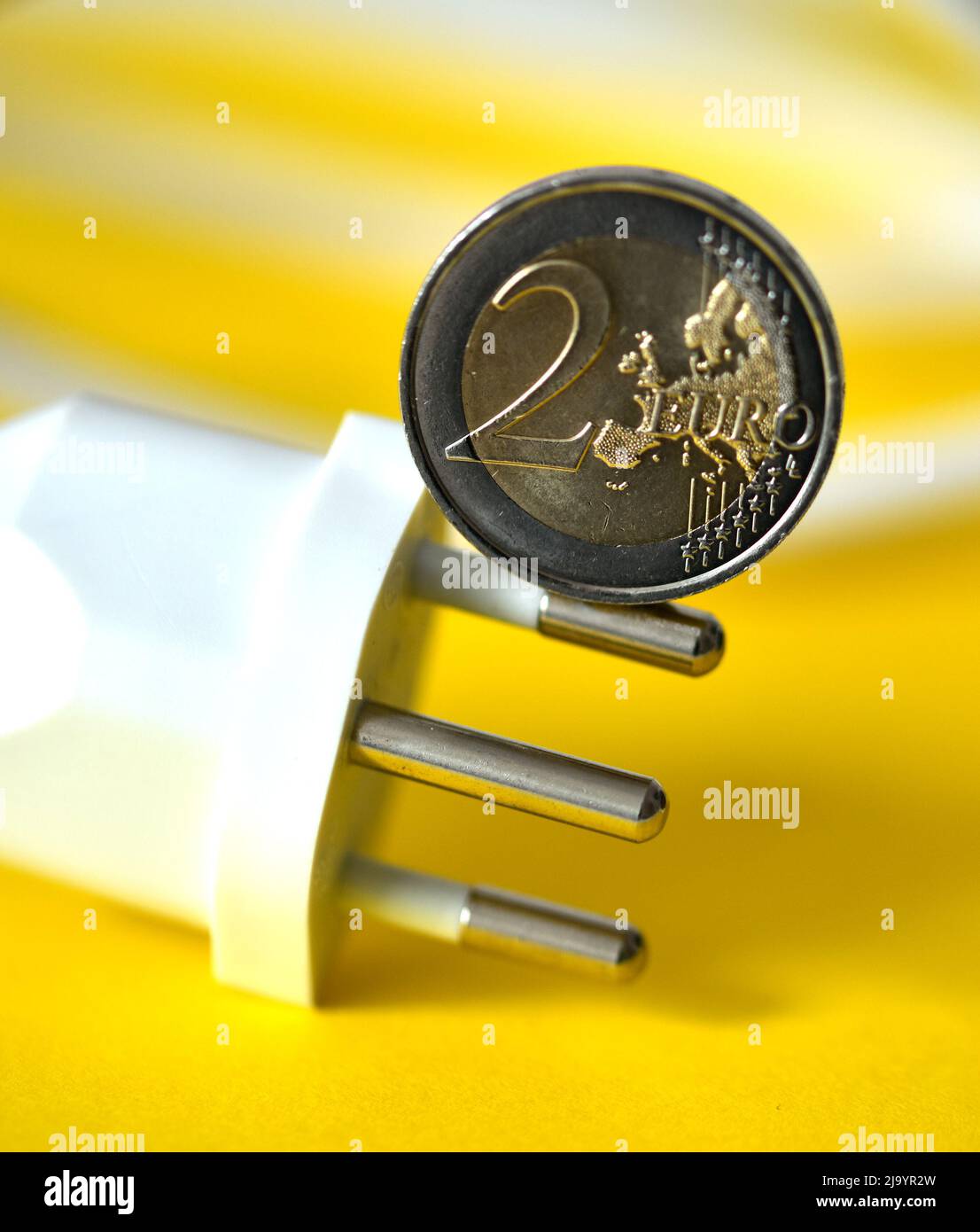 powerplug with euro money coin Stock Photo - Alamy