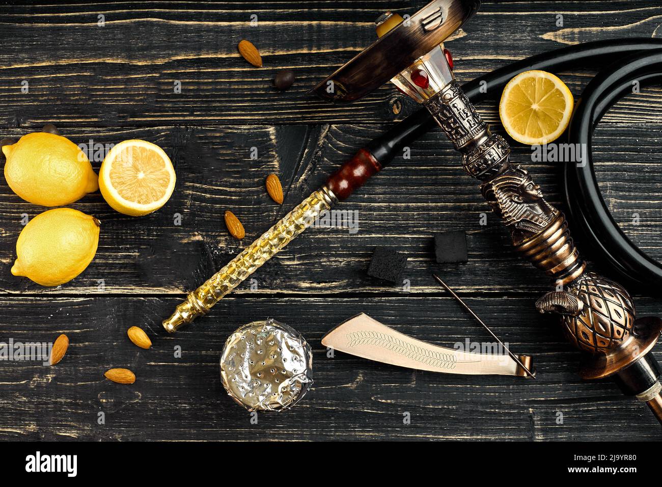 Dismantled parts of hookah on a wooden background with lemon fru Stock ...