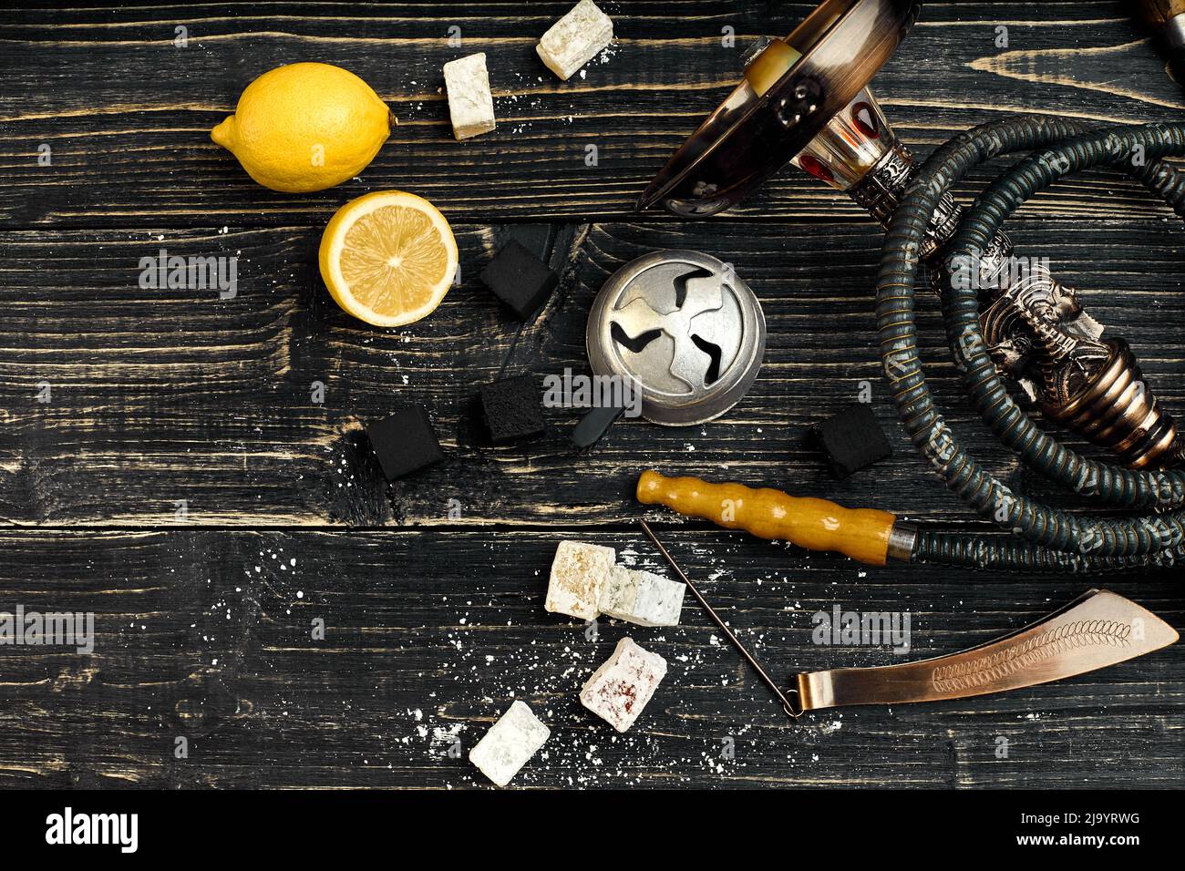 Dismantled parts of hookah on a wooden background with lemon fru Stock ...