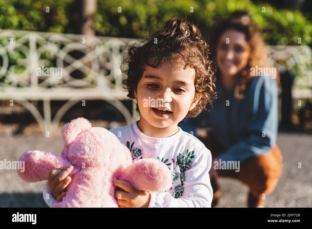 happy single mother and doughter playing and running outdoors in the ...