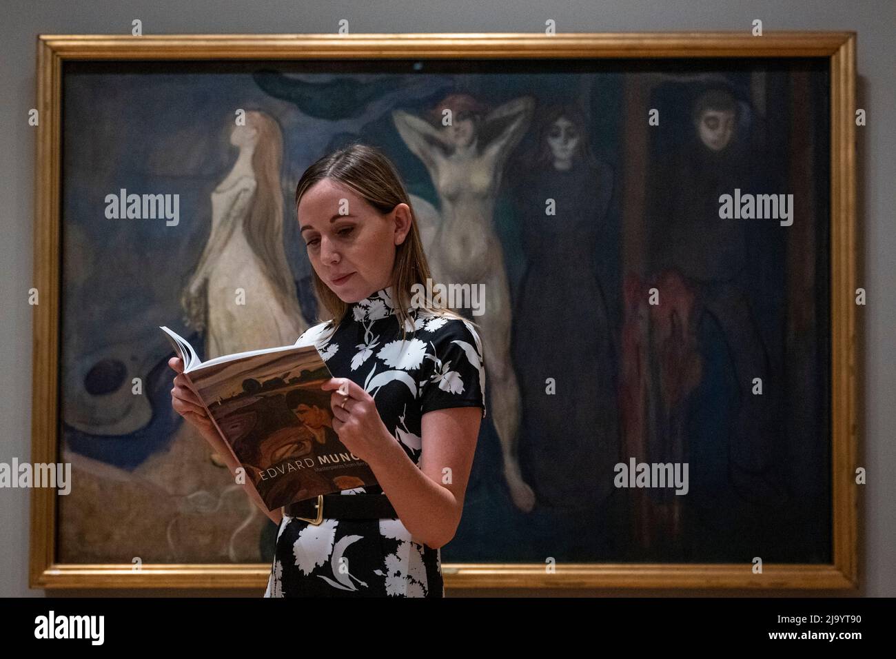London, UK. 26 May 2022. A staff member views a brochure in front of ...