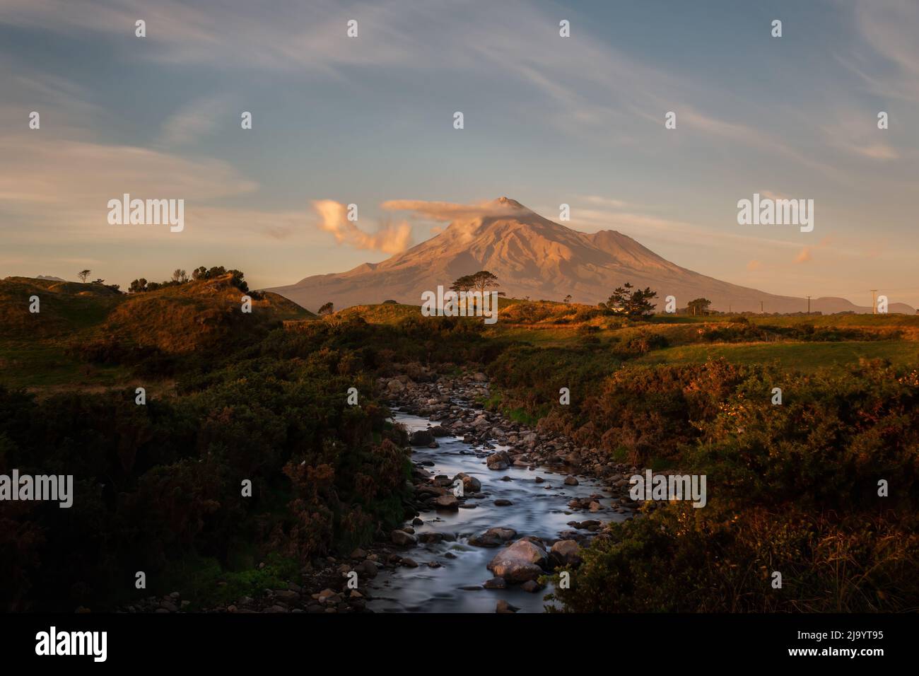 Mt Taranaki and stony river at sunset, Taranak, New Zealand Stock Photo ...
