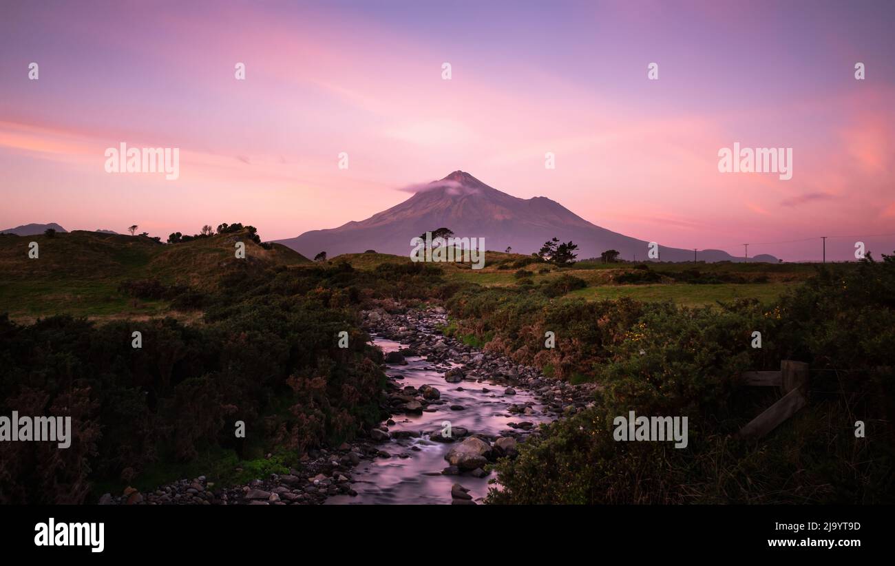 Mt Taranaki and stony river at sunset, Taranak, New Zealand Stock Photo ...
