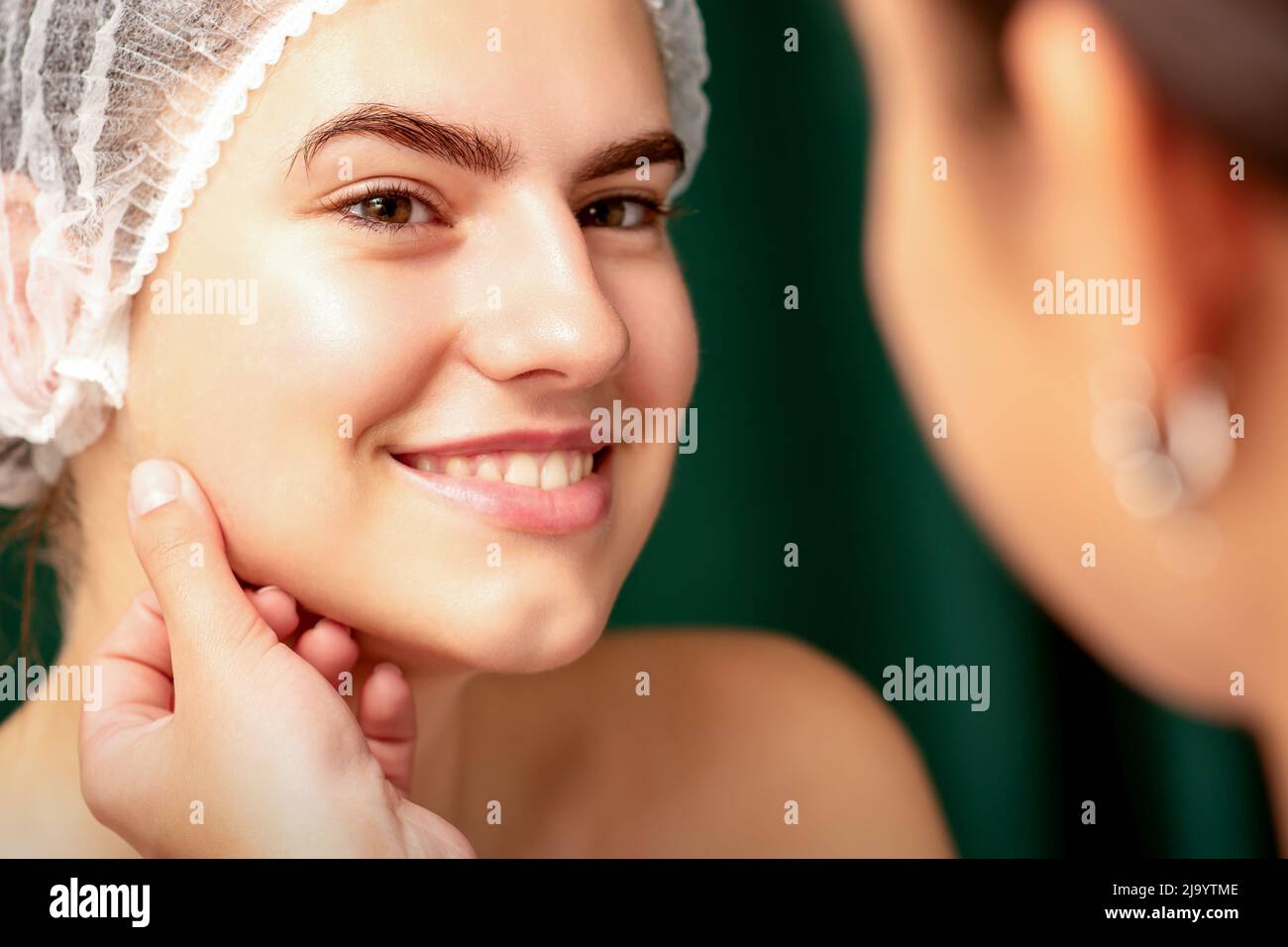 Plastic surgery and beauty concept. Professional cosmetician examining ...