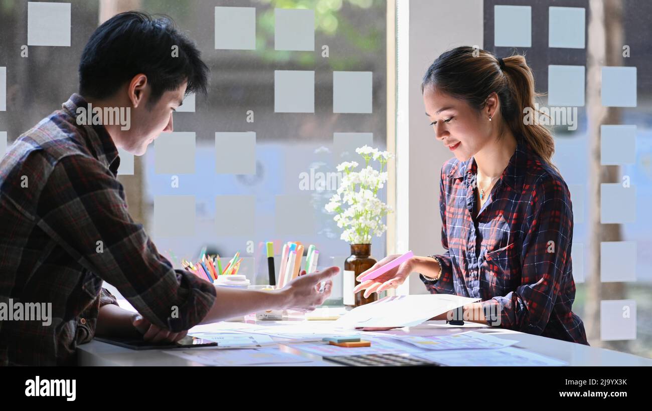 Focused web developer team planning sketch, prototype, framework ...