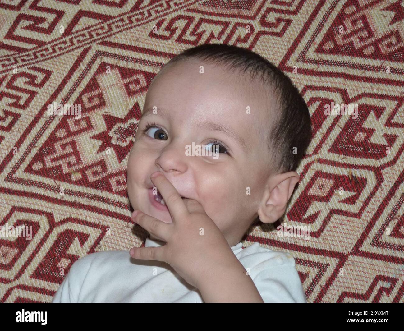 mischievous boy looking down at camera Stock Photo - Alamy