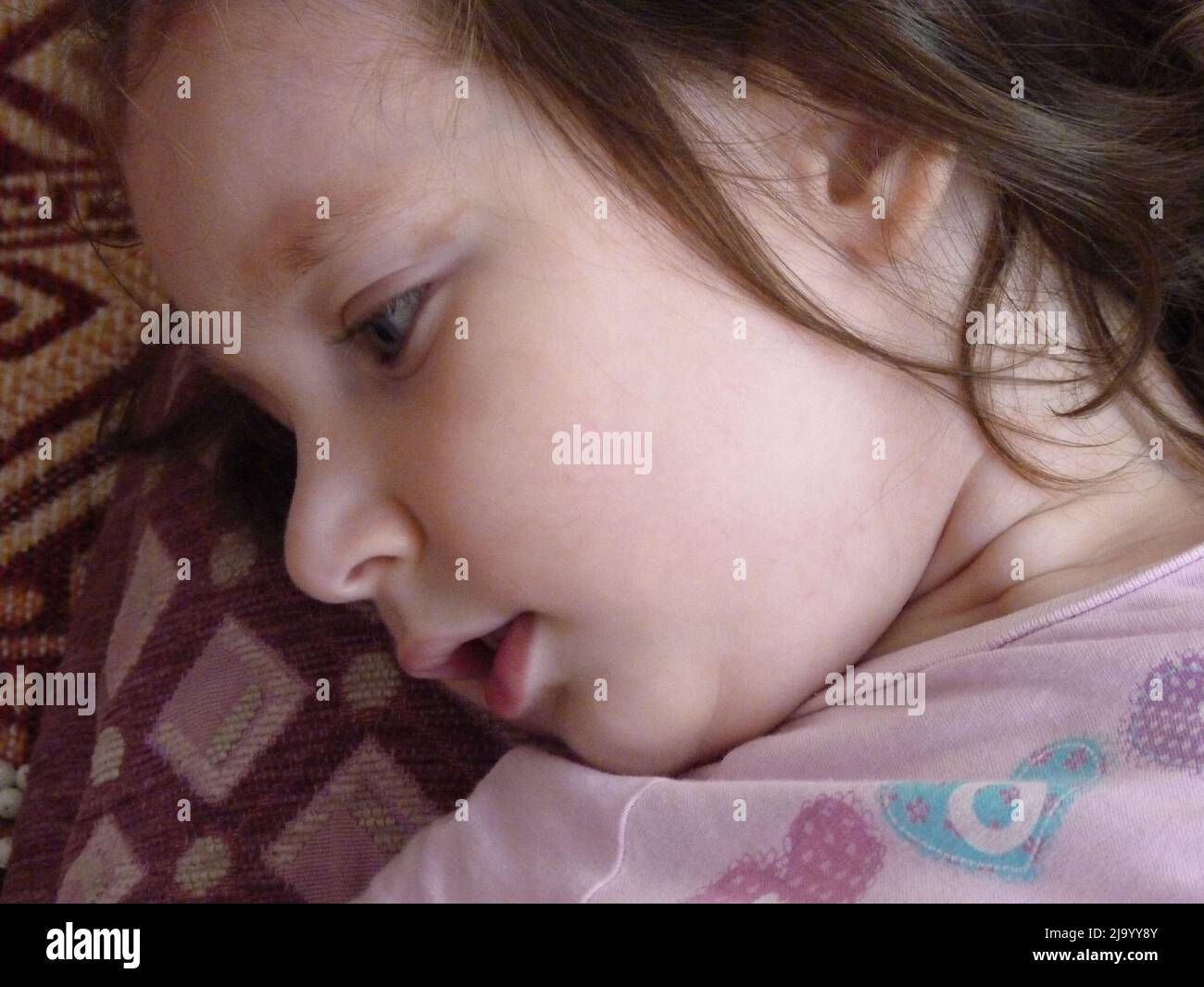 a blue-eyed girl makes strange facial movements Stock Photo - Alamy