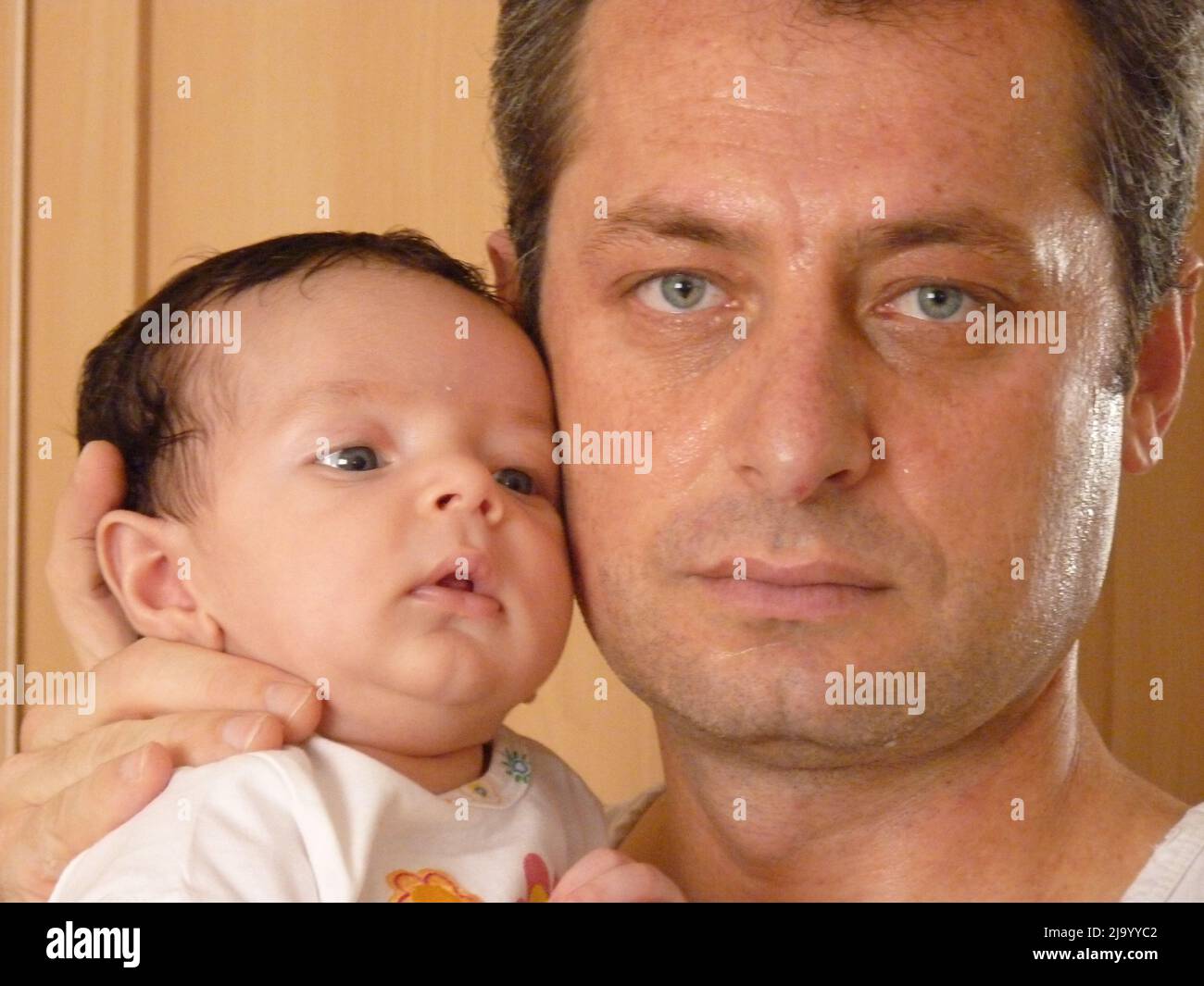 newborn baby and his excited, puzzled father Stock Photo - Alamy