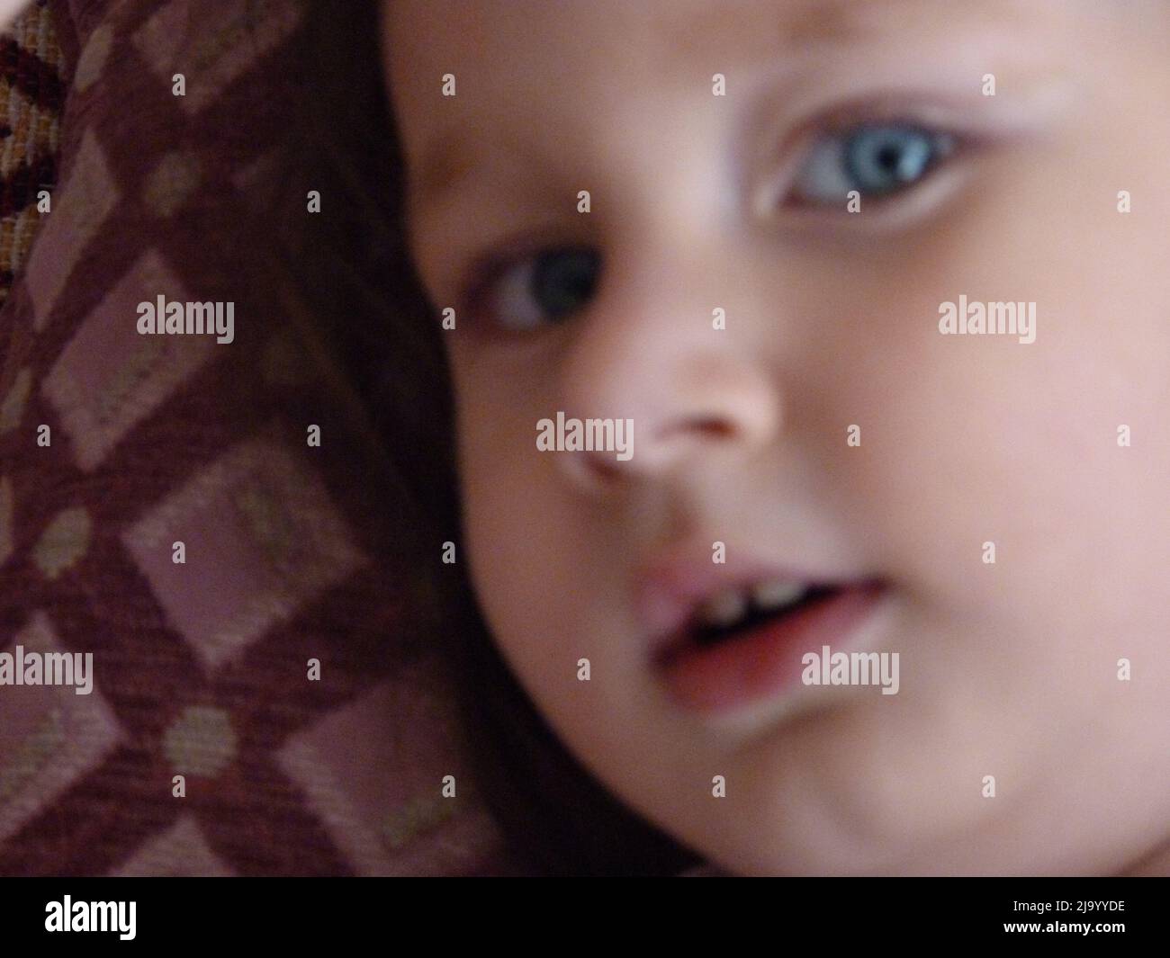 a blue-eyed girl makes strange facial movements Stock Photo - Alamy