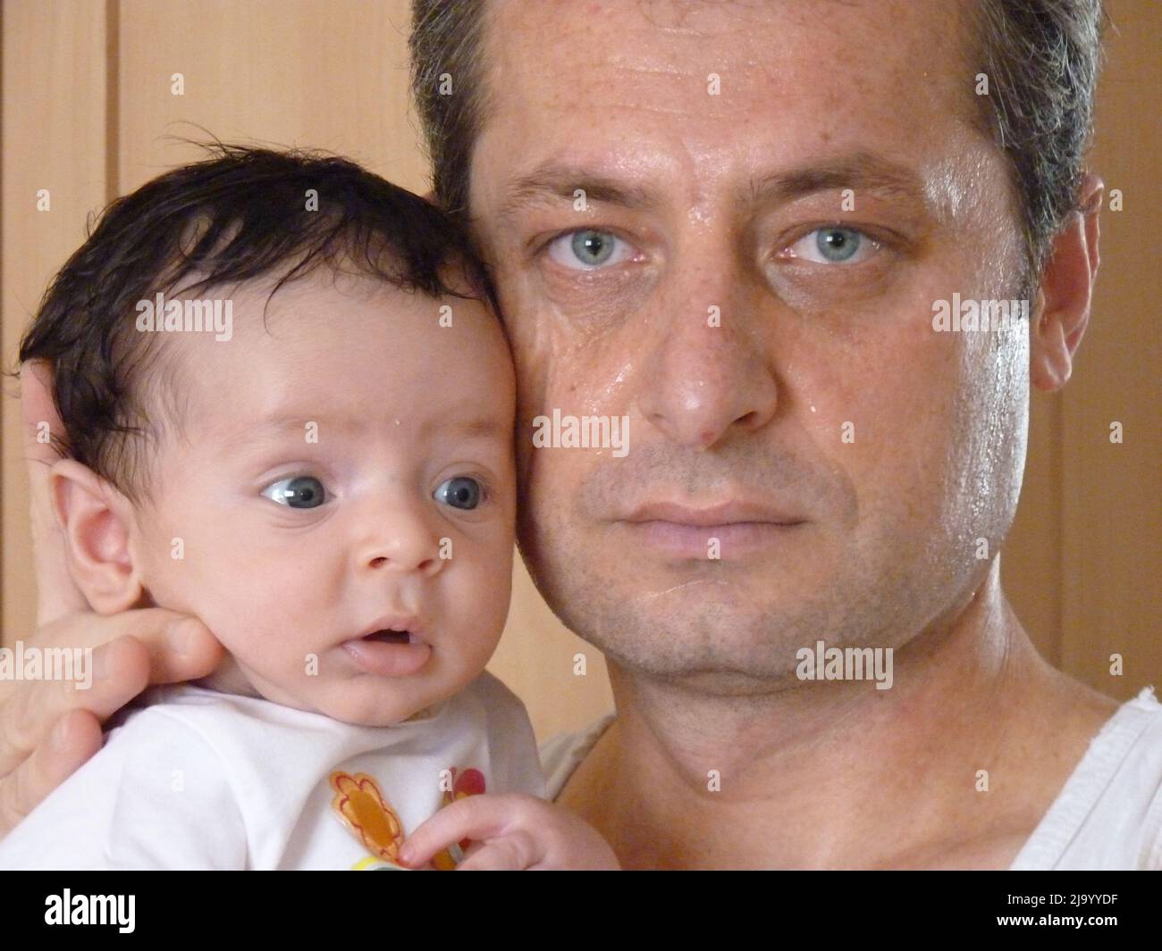 newborn baby and his excited, puzzled father Stock Photo - Alamy