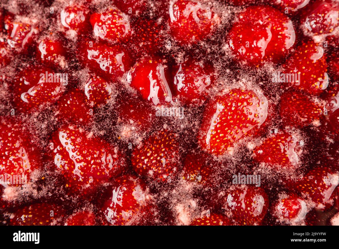 Strawberry jam, top view. Homemade Strawberry jam in making progress ...