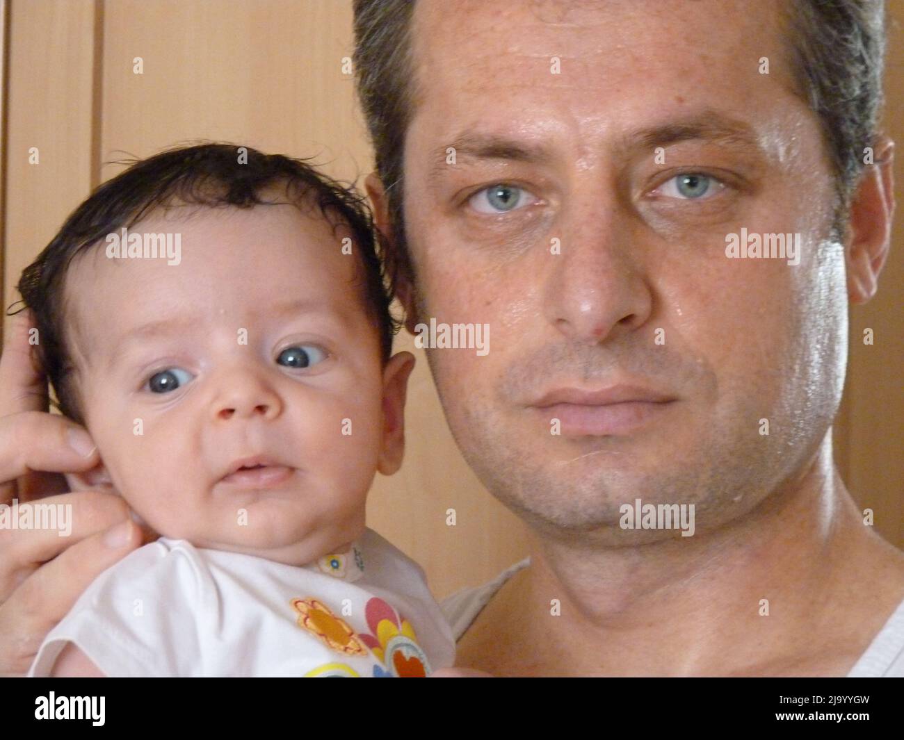 newborn baby and his excited, puzzled father Stock Photo - Alamy