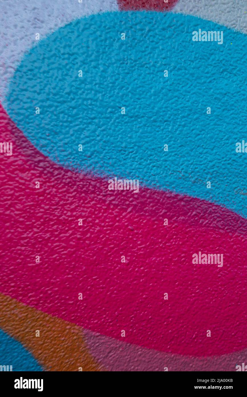 Fragment of the wall with blue red brown colors graffiti painting in ...