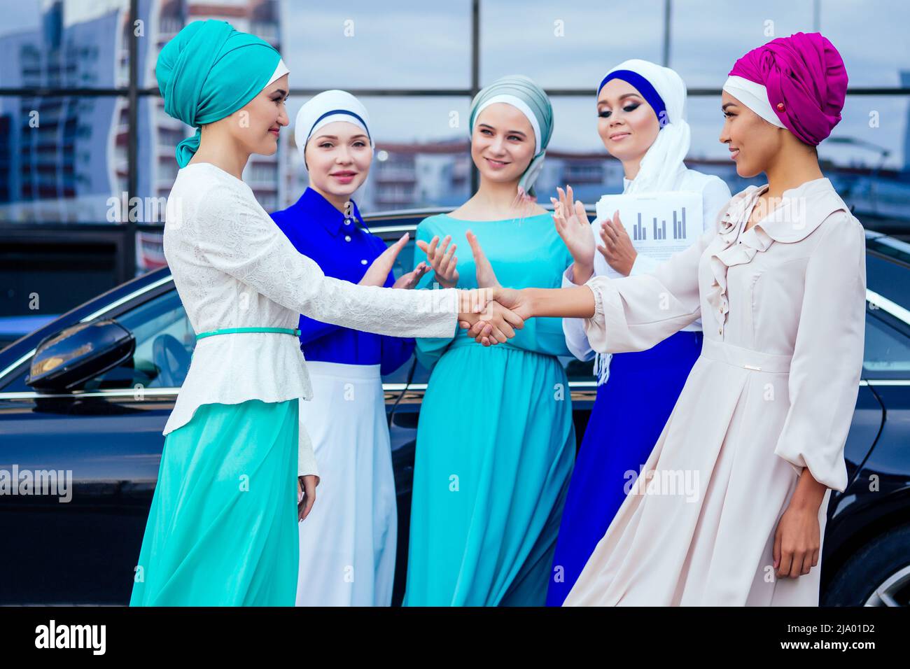 group of five caucasian Muslim office lady discussing with a ...