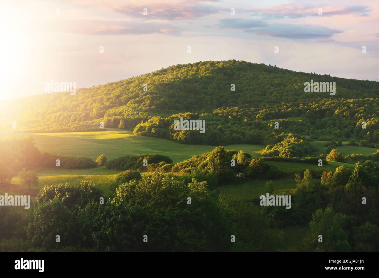 Green hill lit by sun setting down.Spring landscape. High quality photo ...