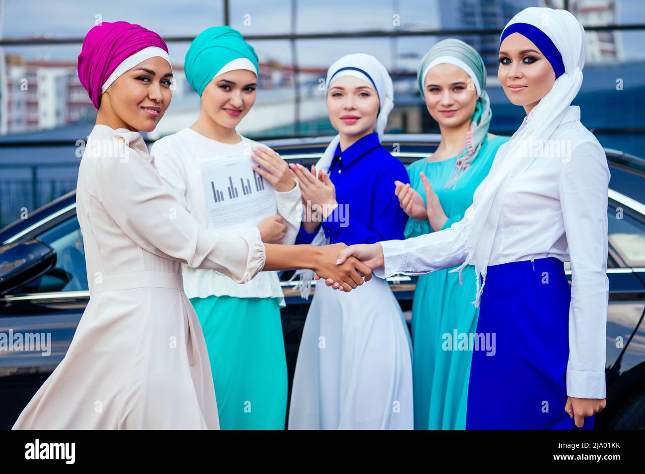 group of five caucasian Muslim office lady discussing with a ...