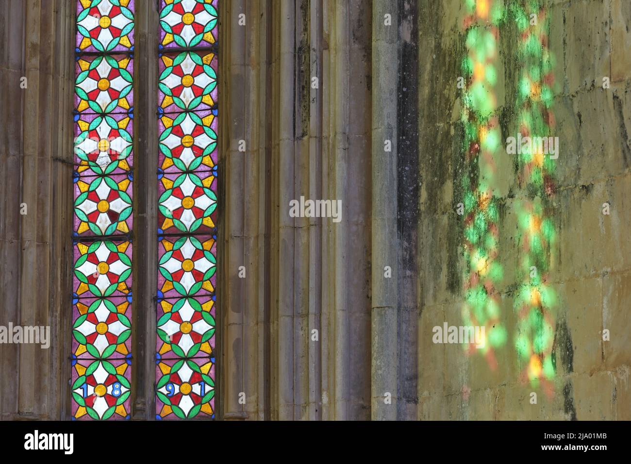 stained glass windows and pillars in Interior of the Unfinished chapels ...