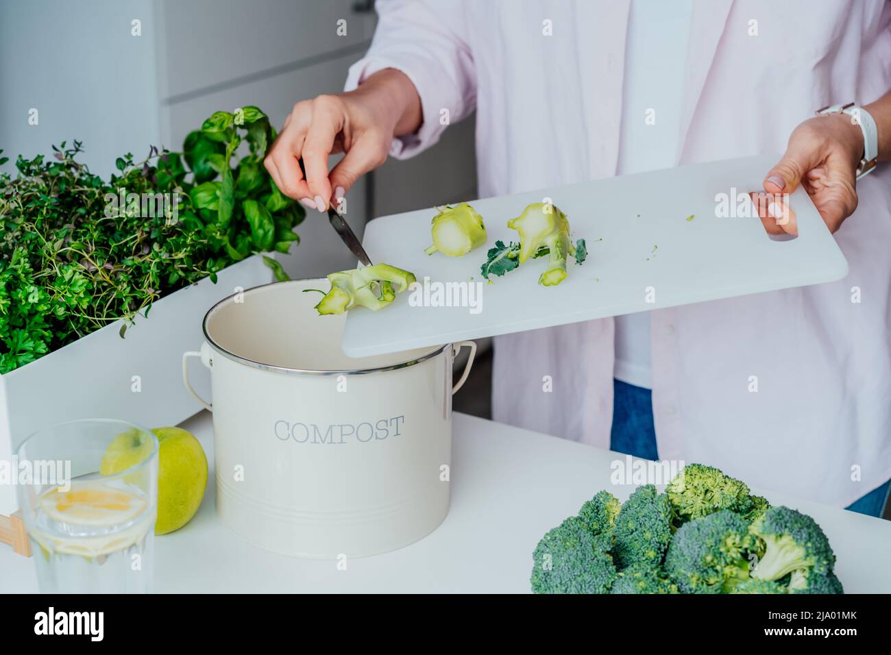 Compost the kitchen waste, recycling. Close up woman scraping, throwing ...