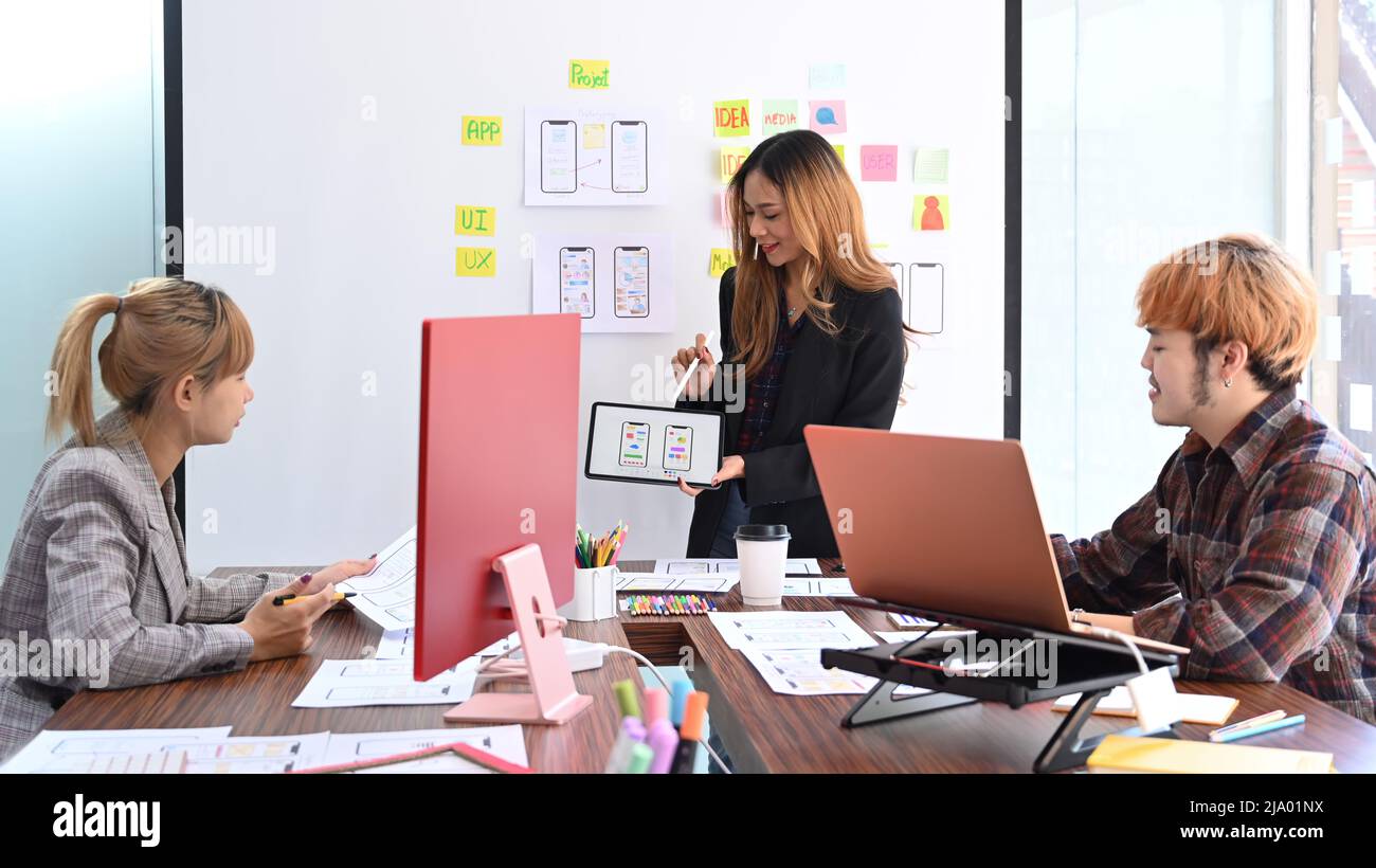 Group of web developer discussion, brainstorming new approaches and ...