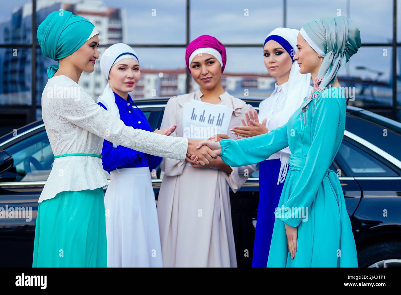group of five caucasian Muslim office lady discussing with a ...