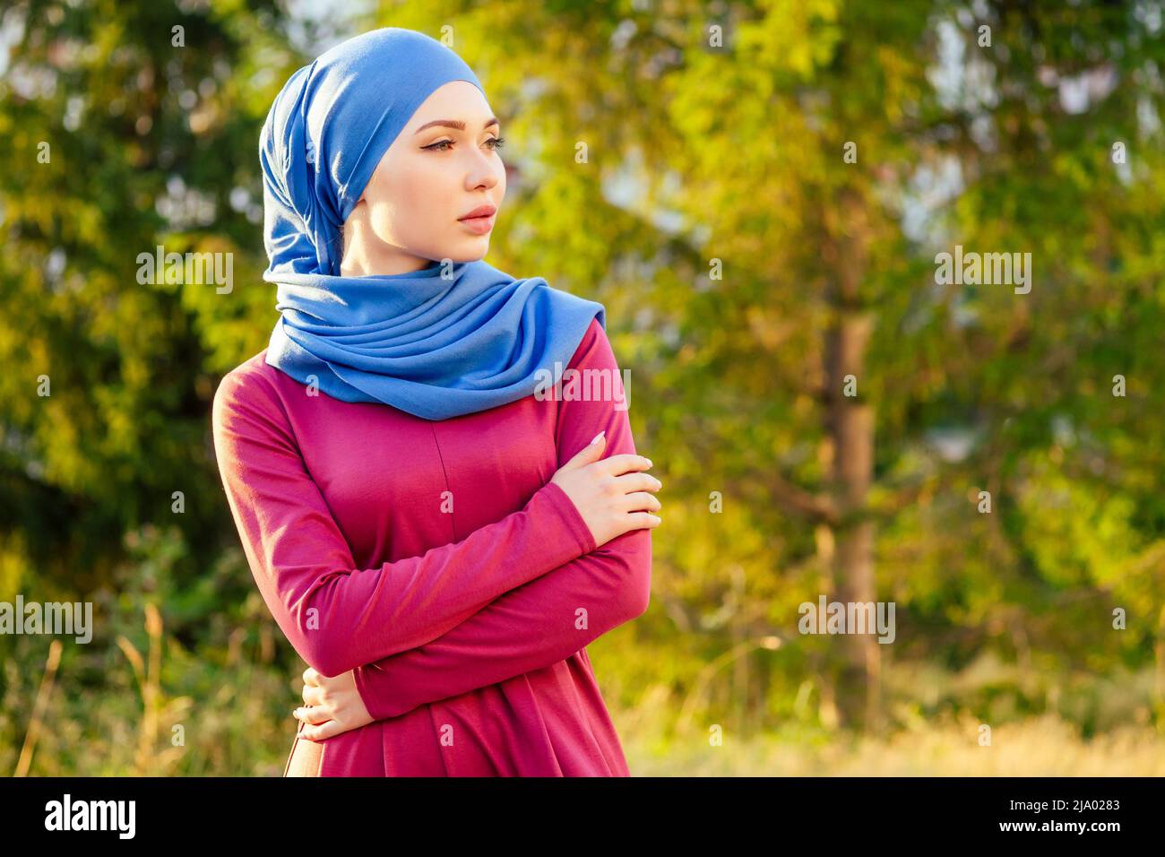 Islamic Beautiful Woman In A Muslim Virgin Dress Standing On A Summer 4945