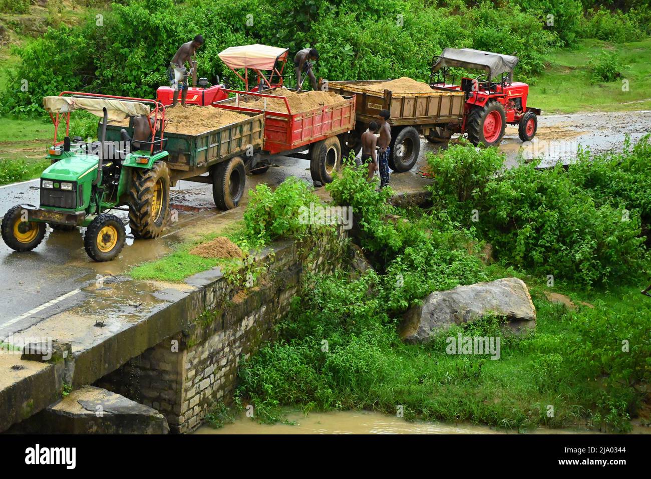 river sand uploading in tractor Stock Photo - Alamy