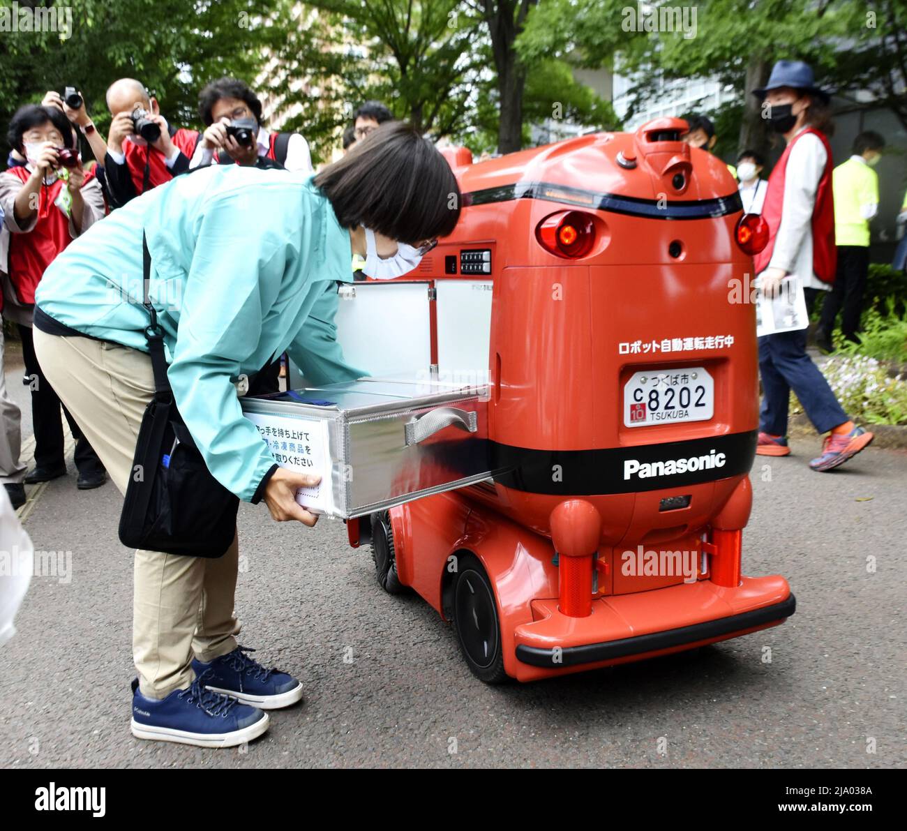 Tsukuba, Japan. 26th May, 2022. Merchandise is loaded onto a delivery ...