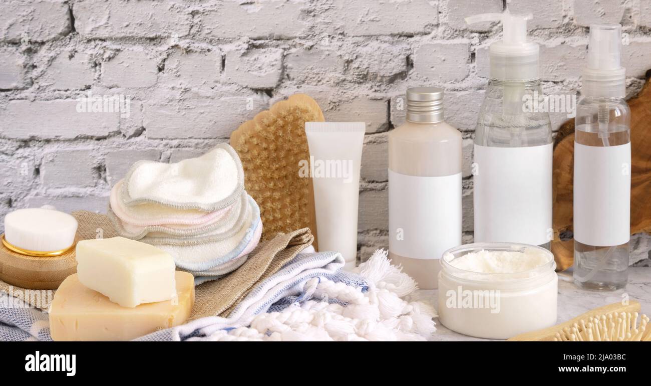 Homemade Skin care cosmetics and bath accessories against white brick ...