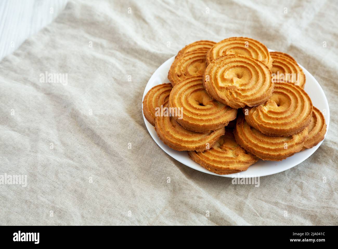 Homemade Sprits Biscuits on a Plate, side view. Copy space Stock Photo ...