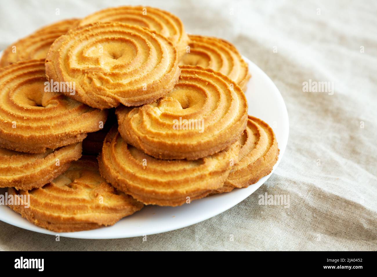 Homemade Sprits Biscuits on a Plate, side view. Space for text Stock ...