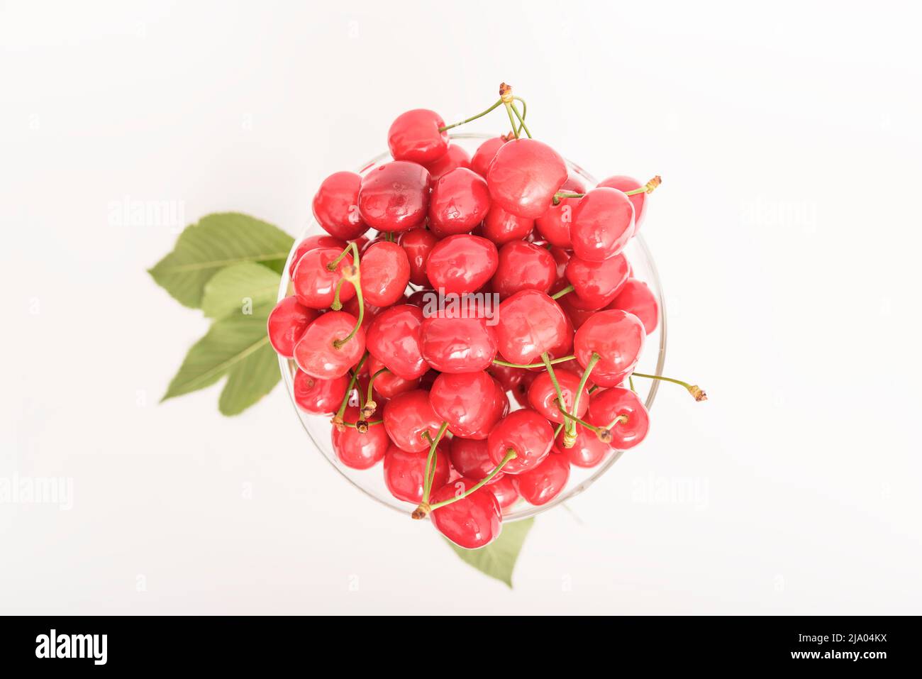 Cherries. Cherry. Cherries in color bowl and kitchen napkin. Red cherry ...