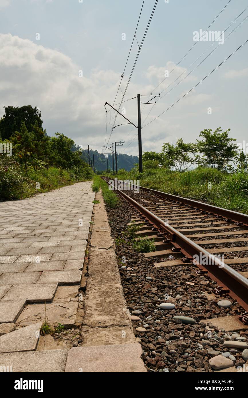 peron railway trees sky supports electric Stock Photo - Alamy