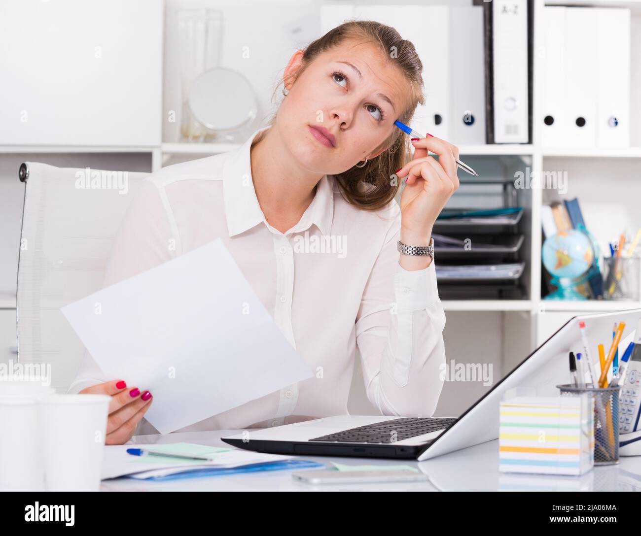Young female is having complicated issue with project Stock Photo - Alamy