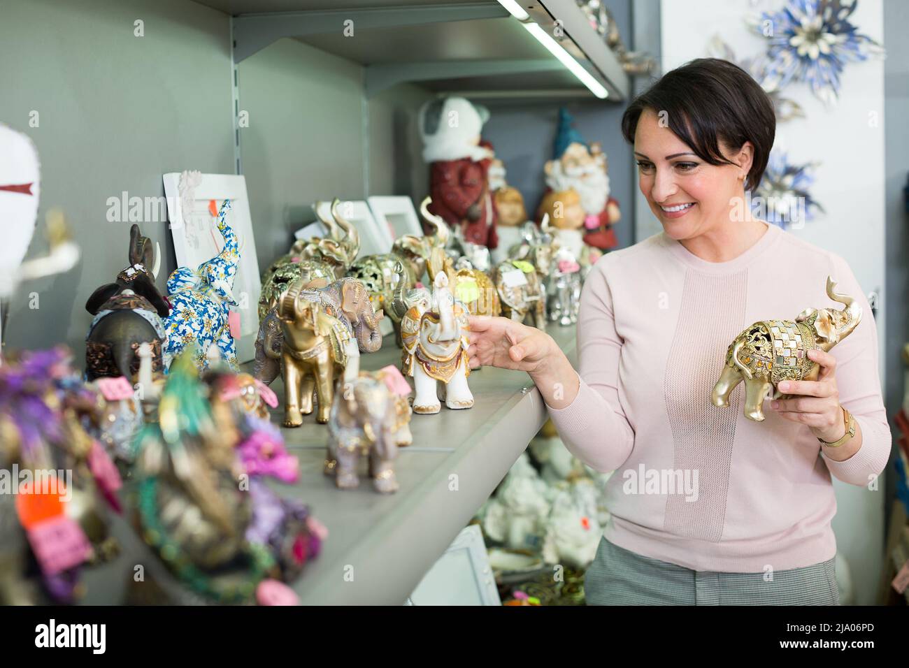 Female customer in souvenir shop Stock Photo - Alamy