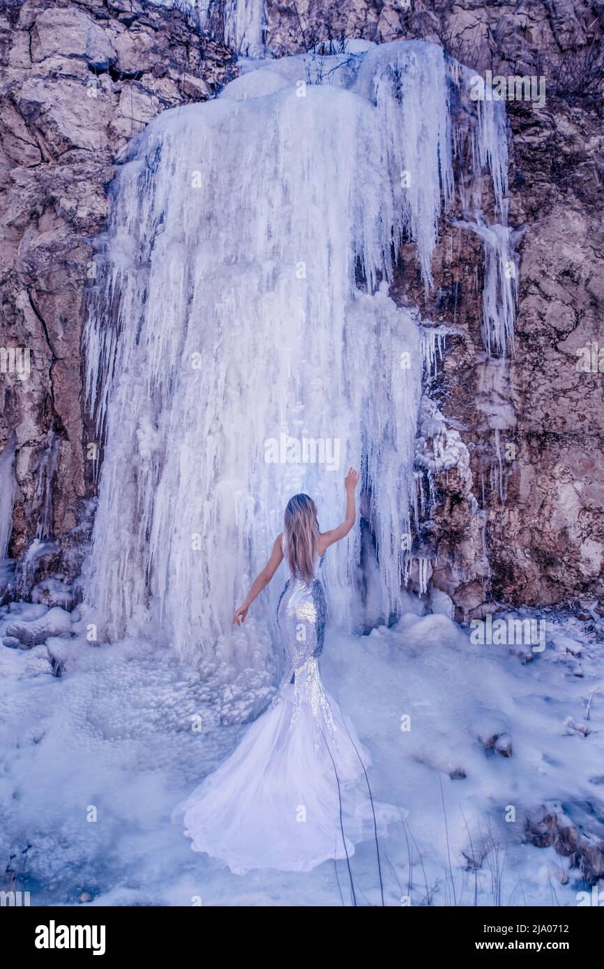 Beautiful woman on ice in winter Stock Photo - Alamy