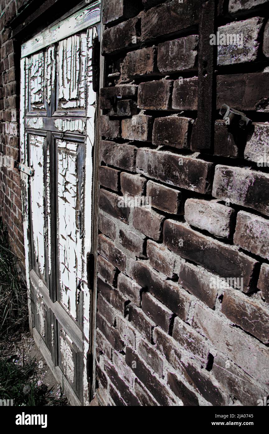 Mystical old door in a brick wall. The remnants of the ghetto give way ...
