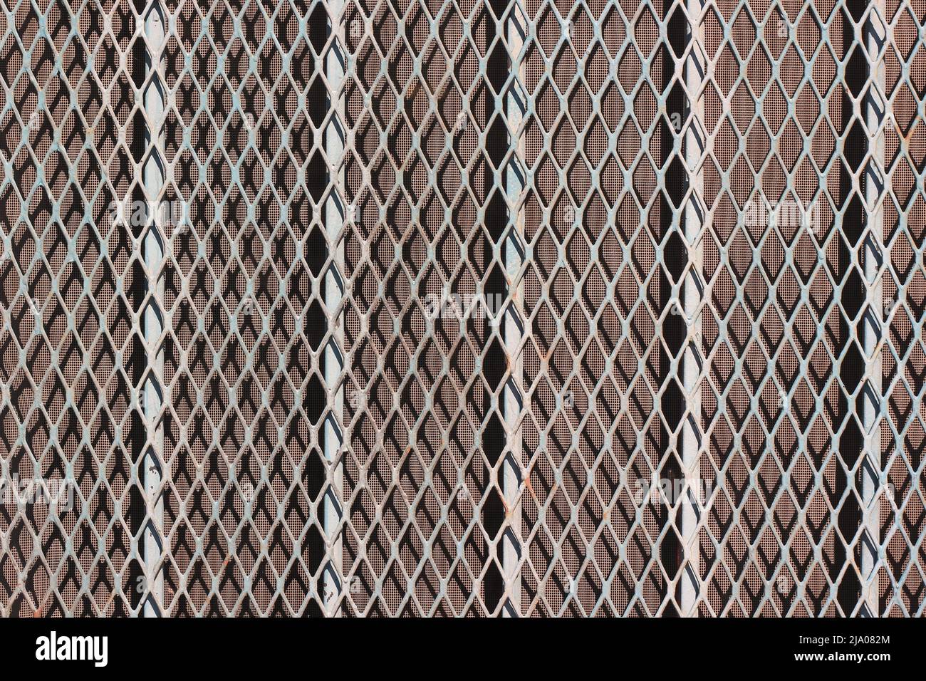 Heavy duty security metal grill protecting a warehouse window Stock ...