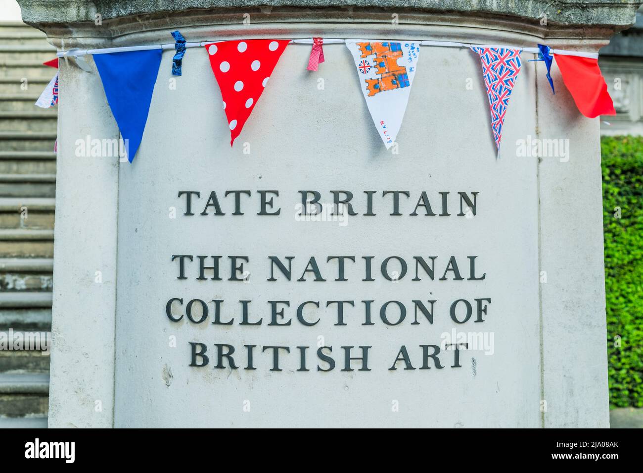 London, UK. 26 May 2022. Tate Britain's facade covered with bunting ...